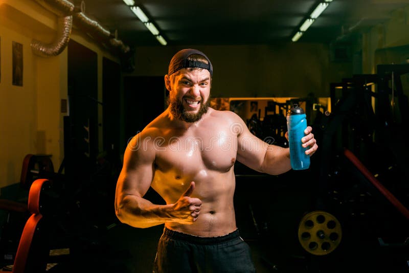 Man in the gym with shaker stock photo. Image of muscular - 60578264