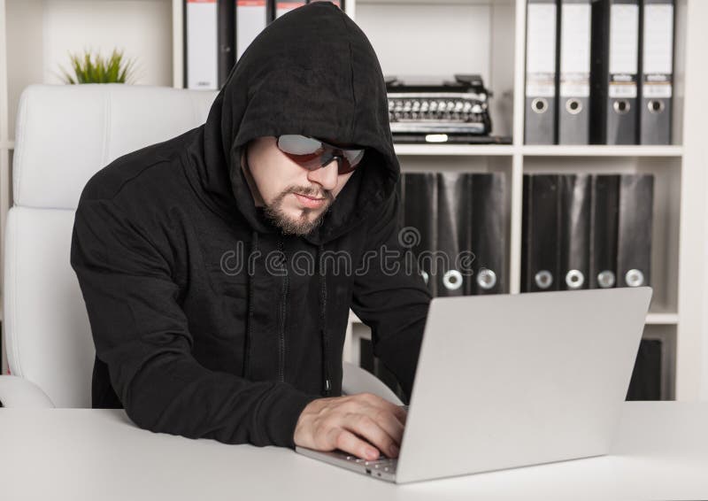 Man Hacker Using Laptop in Office Stock Photo - Image of person ...