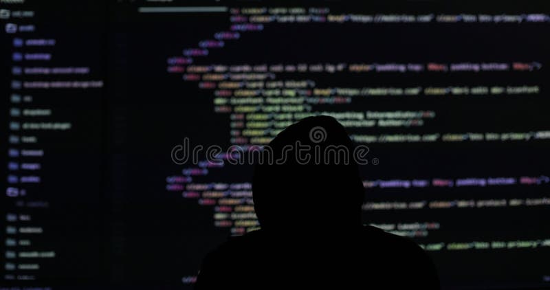 Man Hacker Working In Dark Abstract Room Programming Code On A Large