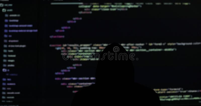 Man Hacker Working In Dark Abstract Room Programming Code On A Large 9477