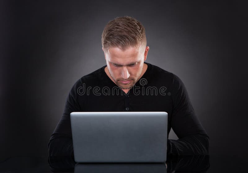 Man or Hacker Working on a Laptop at Night Stock Image - Image of black ...