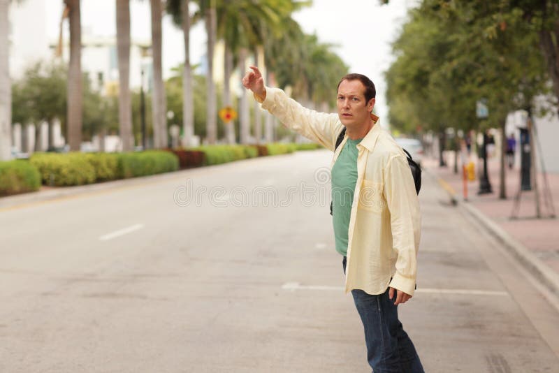 Man Hailing a cab stock image. Image of hail, street, male - 6250189