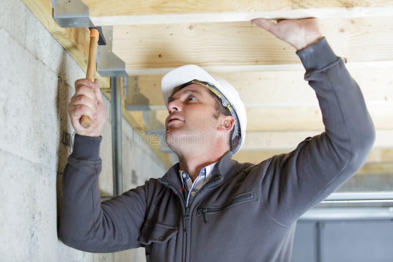 Man hammering nails stock photo. Image of close, nail - 254430626