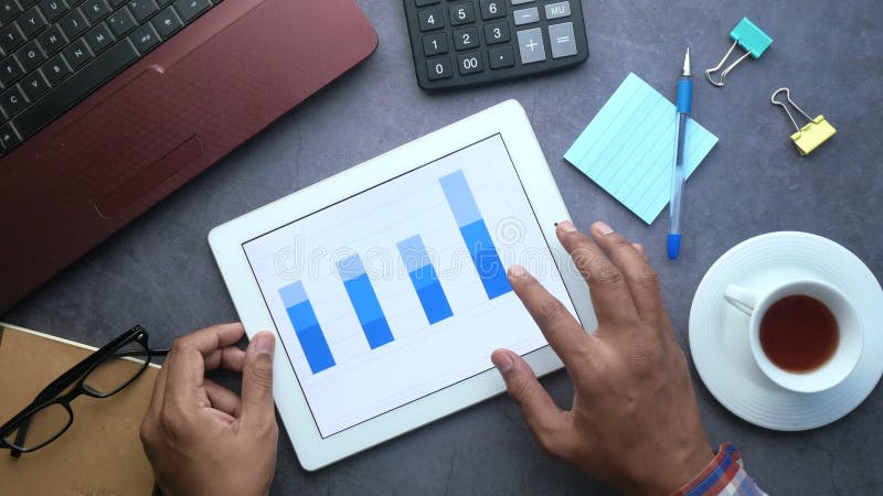 Man Hand Analyzing Charts on Digital Tablet, Using Self Created Chart ...