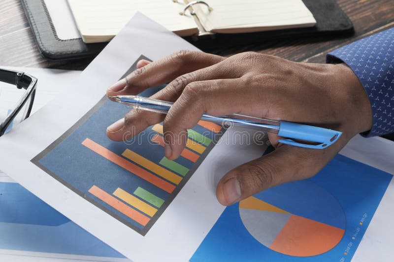 Man Hand Analyzing Financial Diagram on Office Desk Stock Photo - Image ...