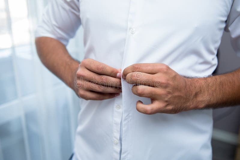 Man hand button of shirt stock photo. Image of accessory - 213753040