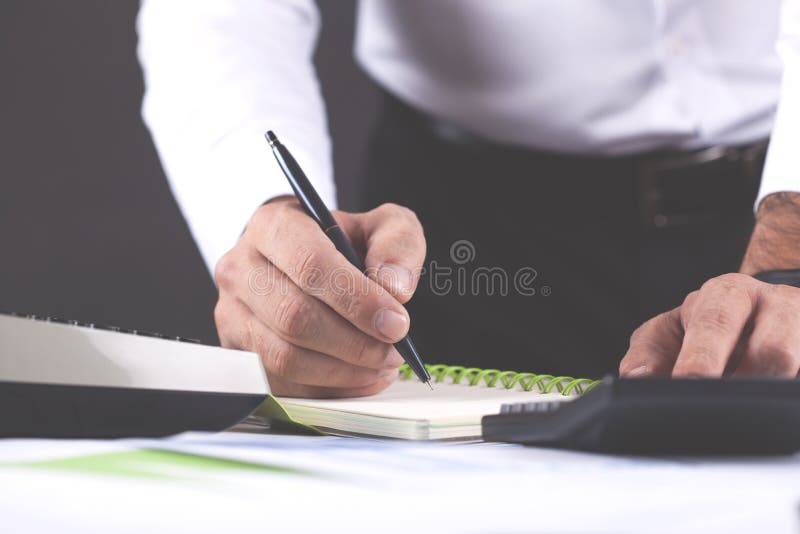 Man Hand Calculator and Notepad in Office Stock Photo - Image of ...