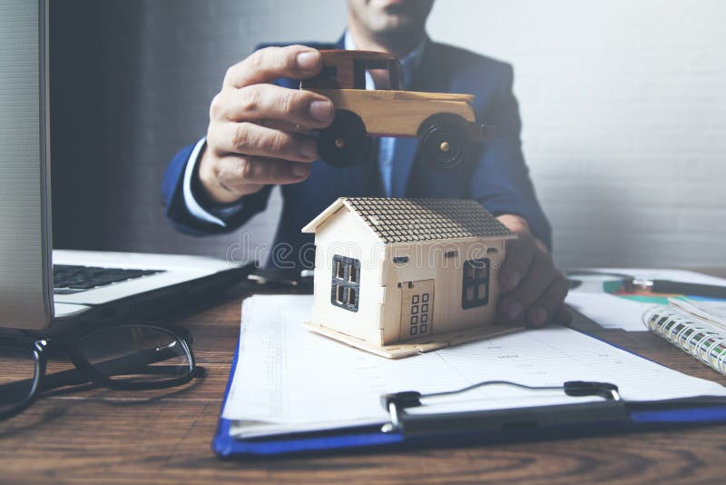 Man Hand Car and House Model on Document Stock Photo - Image of ...