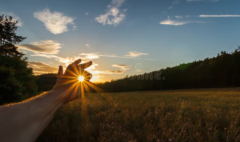 Man Hand Catch Sun at Sunset on Field with Forest and Sky. Czech ...