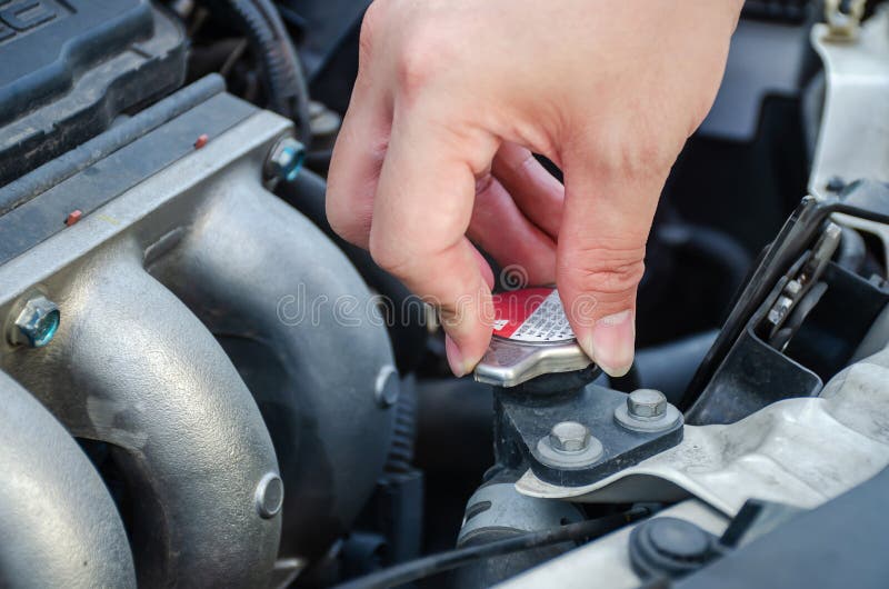 Man Hand Checking Level of Coolant Car Engine. Check and Maintenance ... Man Hand Checking Level of Coolant Car Engine. Check and Maintenance ...