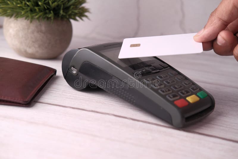 Contactless Payment Concept with Credit Card and Pos Machine on Table ...