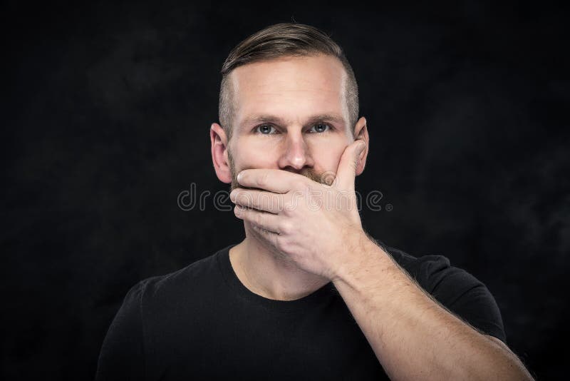 Man with Hand Covering His Mouth Stock Image - Image of darkness, color ...