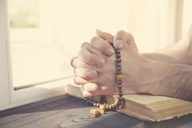 Man hand cross and bible stock image. Image of catholicism - 134668869