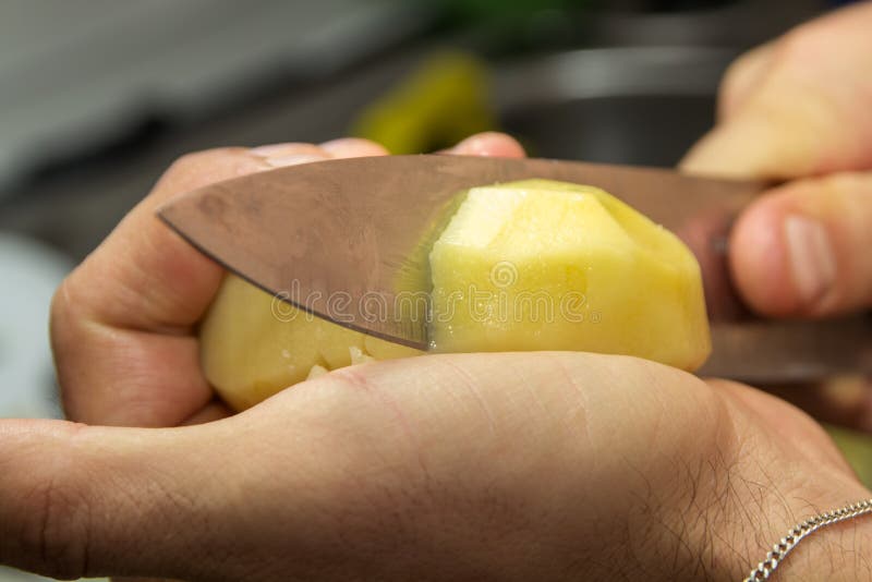 Man Hand Cutting One Potato with Knife Stock Photo - Image of chef ...