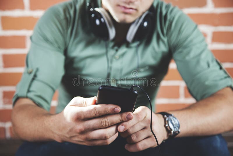Man hand earphone stock image. Image of black, close - 154537095