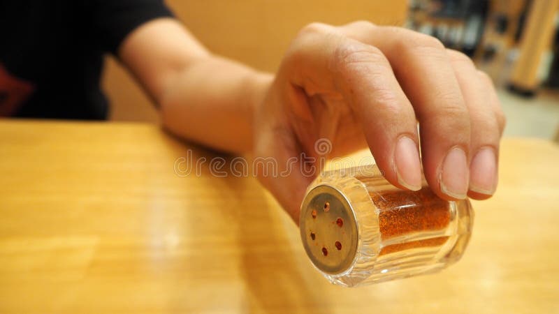 Man Hand Grab a Little Bottle of Cayenne Pepper Stock Photo - Image of ...