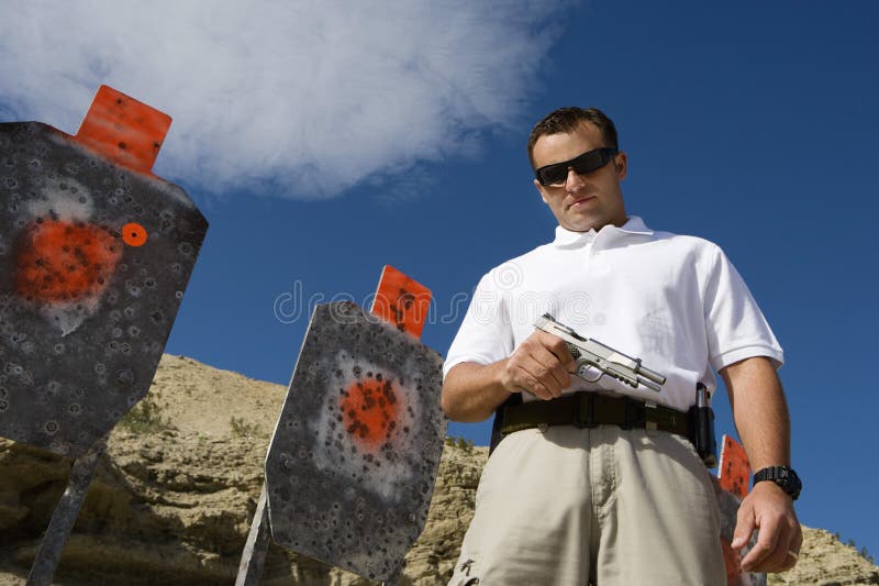 Man with Hand Gun Near Targets at Firing Range Stock Image - Image of ...