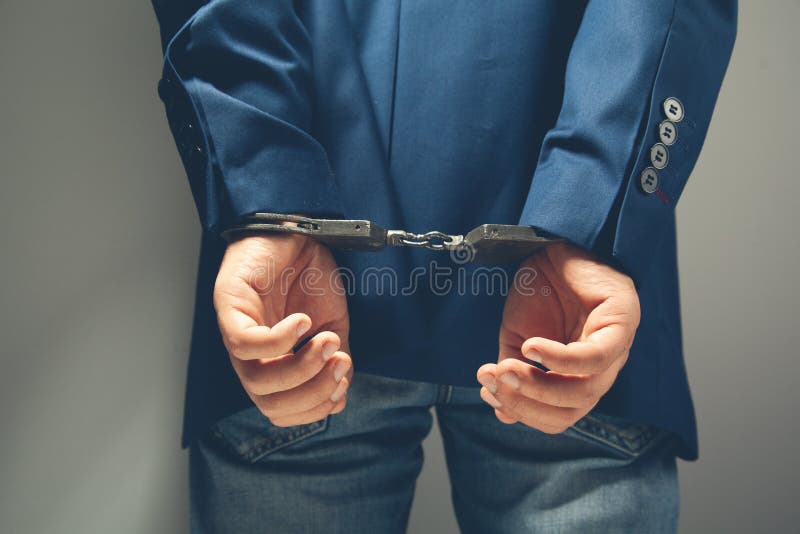 Man hand handcuffs in back stock image. Image of arrest - 209277985
