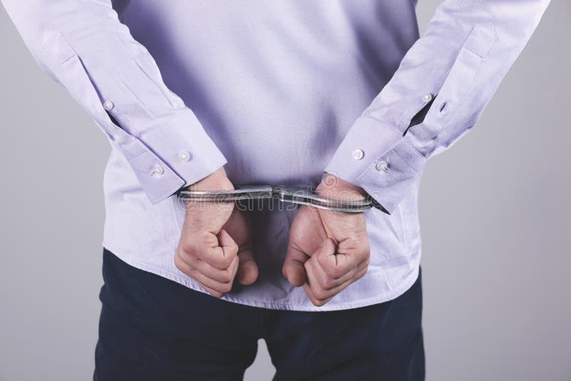 Handcuffs in the Back Pocket,arrest for a Crime Stock Image - Image of ...
