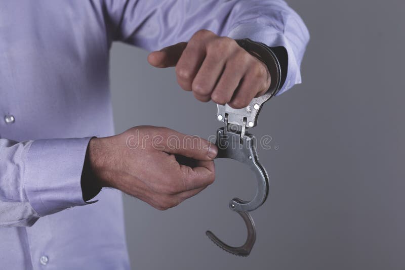Handcuffs in the Back Pocket,arrest for a Crime Stock Image - Image of ...