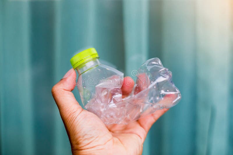 Man Hand Hold and Crushing Plastic Bottle Stock Image - Image of people ...
