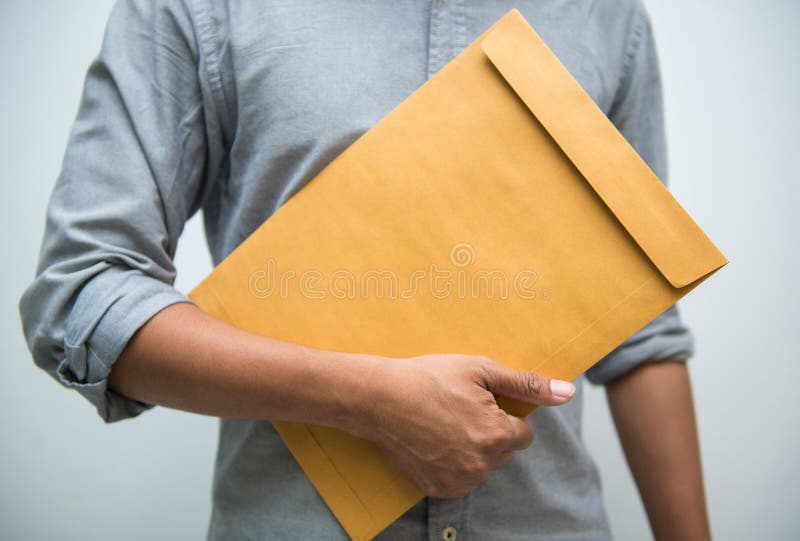 Hand Holding Brown Envelope On White Background Stock Image - Image of ...
