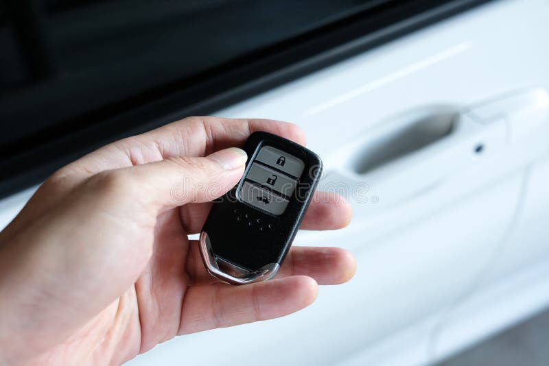 Man Hand Holding the Car Remote, he Push the Remote Control To Open the ...