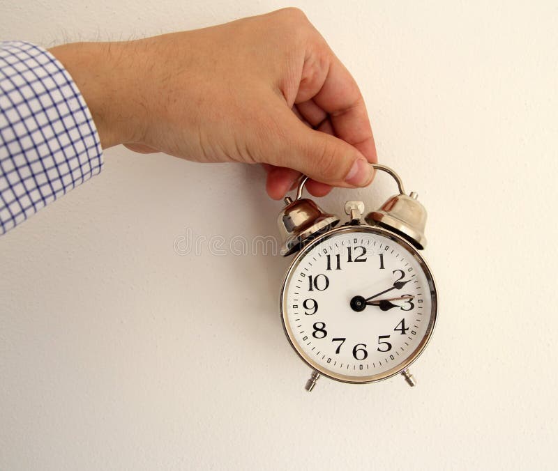 Man hand holding clock stock image. Image of clock, bell - 42985129