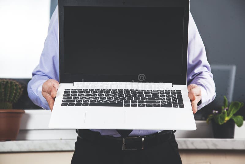 Man hand holding computer stock image. Image of modern - 142973695