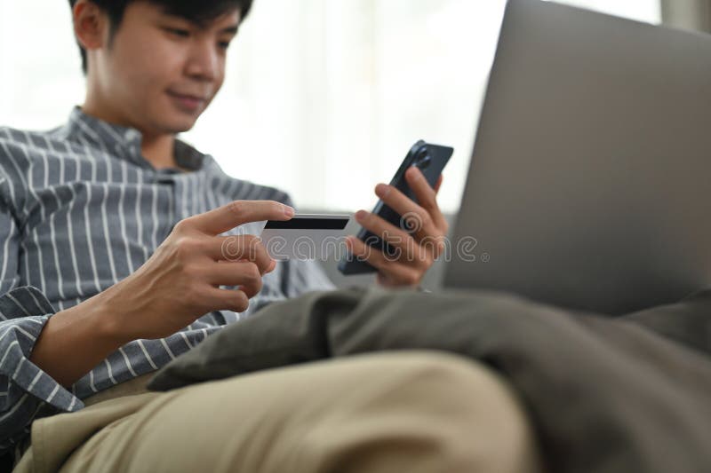 Man Hand Holding Credit Cad and Using Mobile Phone for Online Banking ...