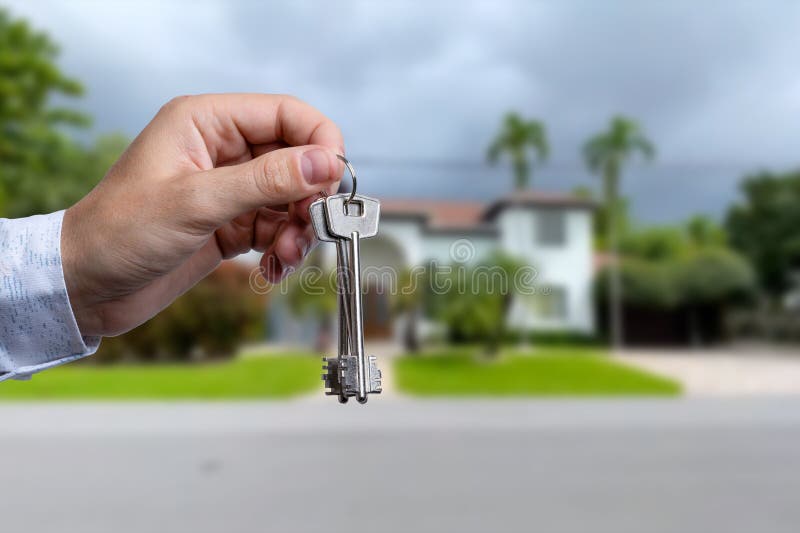 Man Hand Holding on Finger Keys To New House. Stock Image - Image of ...
