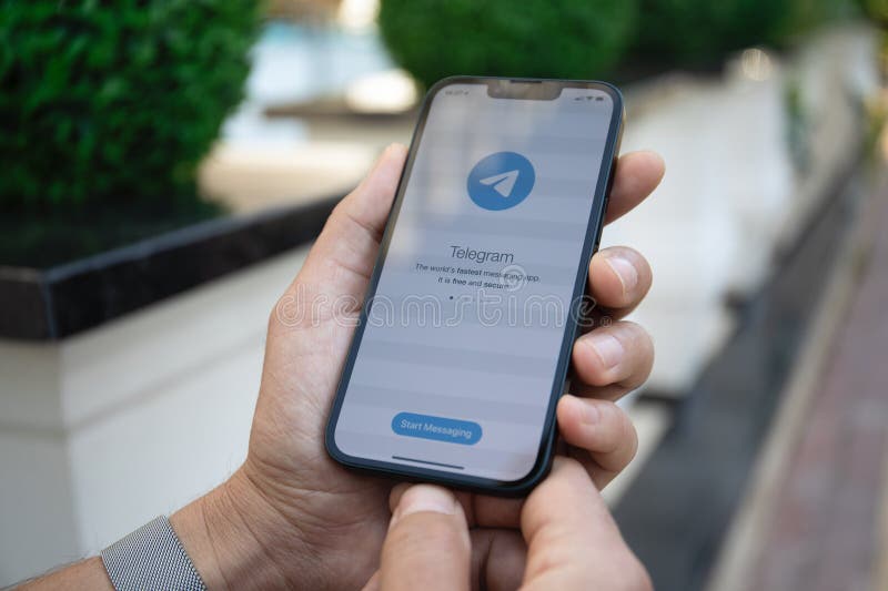 Man Hand Holding IPhone 14 with Social Networking Service Telegram ...