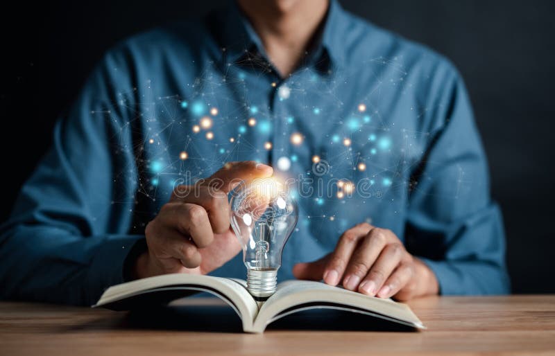 Man Hand Holding Lightbulb with Learning Book Educate and Graduation ...