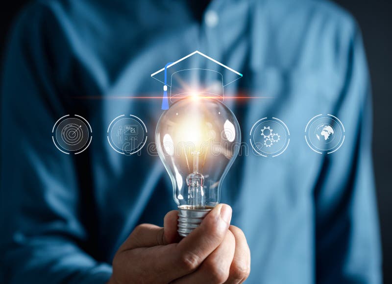 Man Hand Holding Lightbulb with Learning Educate and Graduation Concept ...