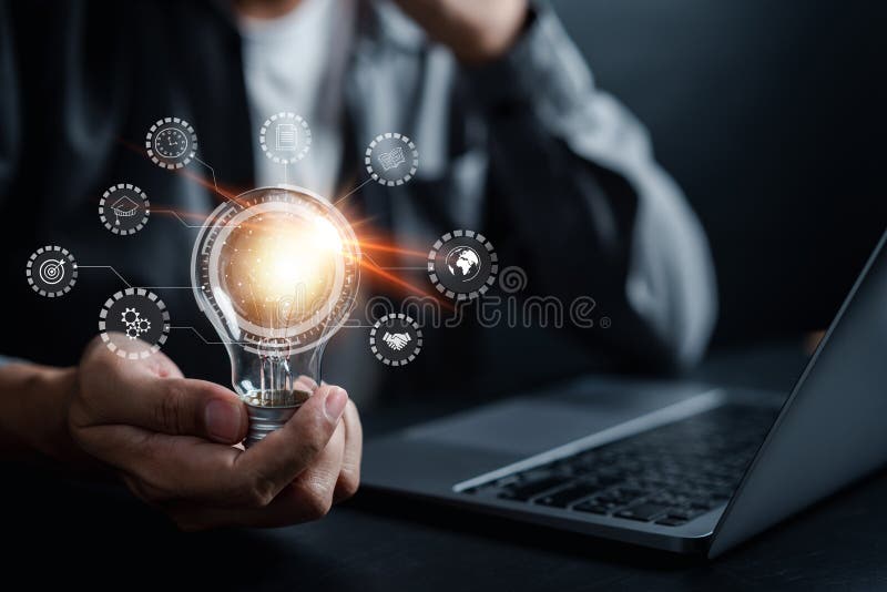 Man Hand Holding Lightbulb with Learning Educate and Graduation Concept ...