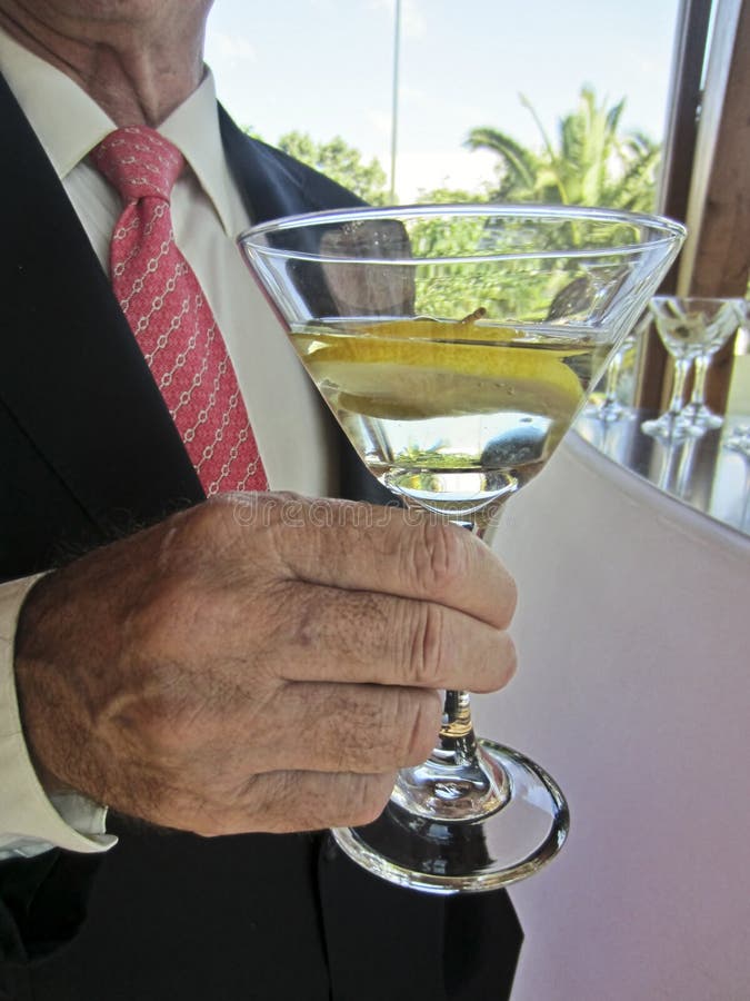 Man Hand Holding Martini Cocktail Stock Image - Image of season, people ...