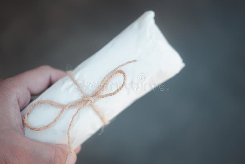 Man Hand Holding Paper Packaging Wrapped by Rope. Stock Photo - Image ...