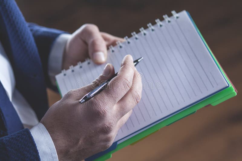 Man Hand Holding Pen and Notepad Stock Image - Image of message, open ...