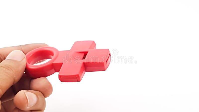 Man Hand Holding the Red Cross Whistle Stock Photo - Image of hold ...