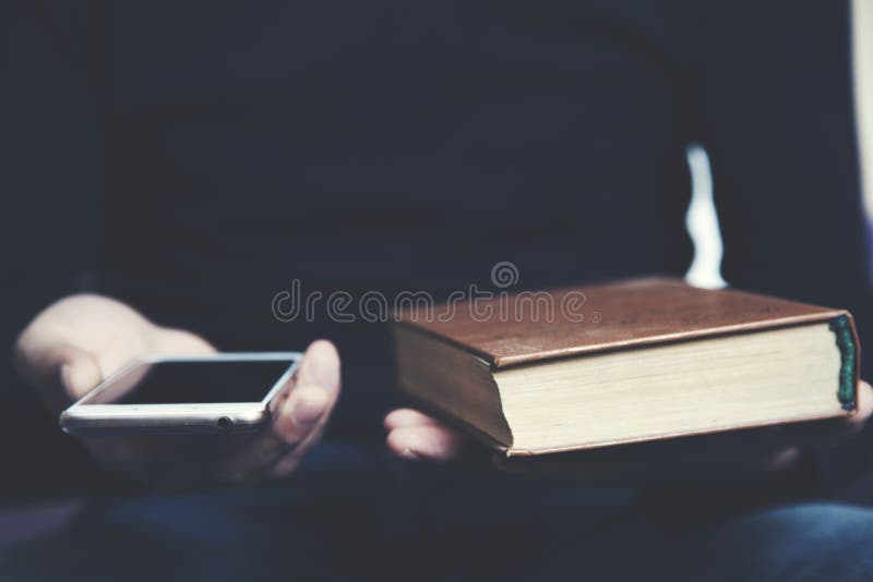 Man Hand Holding Smart Phone and Book Stock Image - Image of screen ...