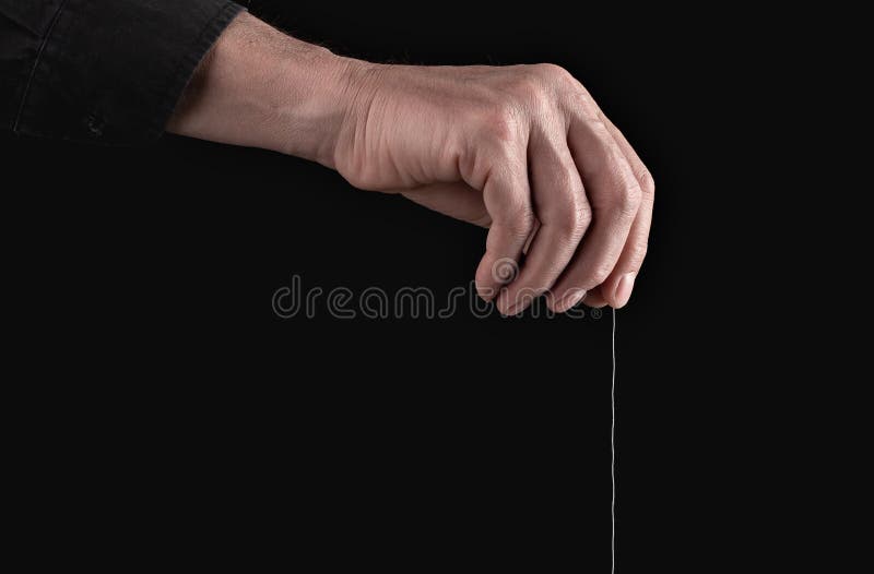 Man Hand Holding String for Manipulation, Exploit, Control. Abuse and ...