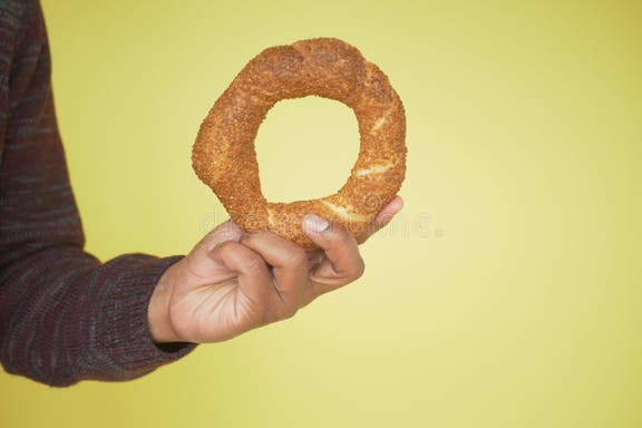 Man Hand Holding a Turkish Bagel Simit Stock Image - Image of tower ...