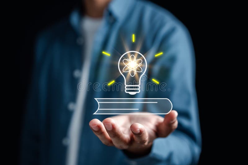 Man Hand Holding Virtual Light Bulb and Book with Learning Educate ...