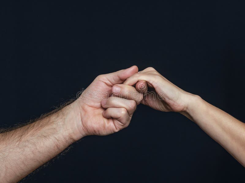 A Man Hand Holds Woman Hand Gently on Black Background Stock Image ...