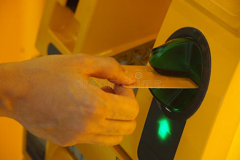 Man Hand Insert Card To Yellow Automated Teller Machine ATM Stock Photo ...
