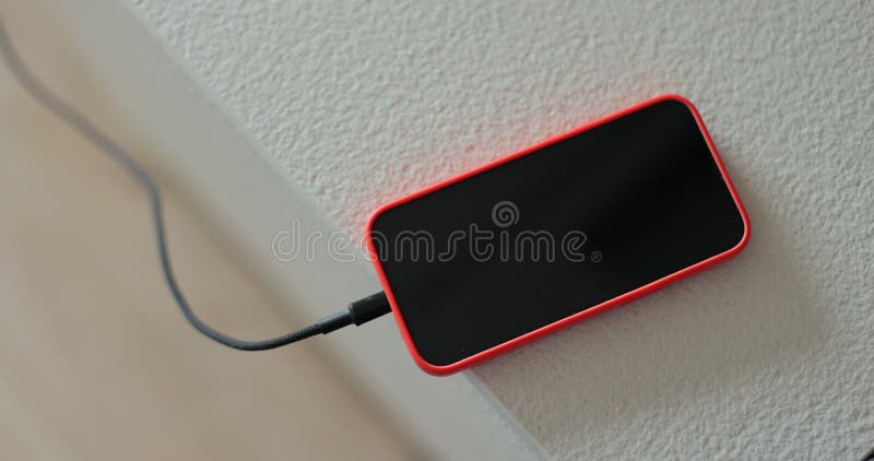 Man Hand Inserting a Charger into a Smartphone. Charging Connection To ...