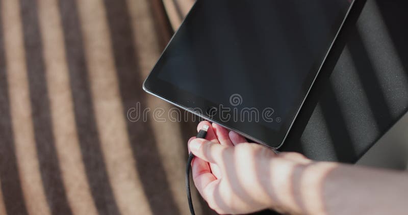 Man Hand Inserting a Charger into a TabletPC. Charging Connection To Your TabletPC. Stock Image ...