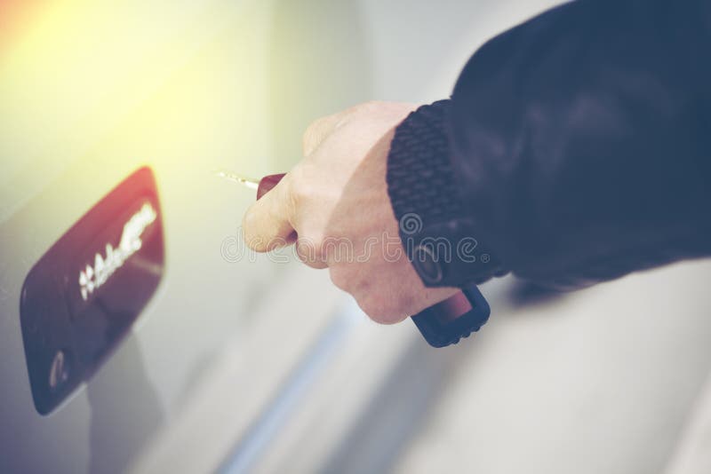 Man Hand Inserting a Key into the Door Lock of a Car Stock Image ...