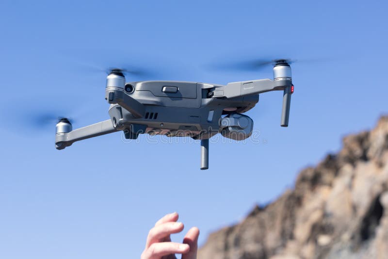 Man Hand Launching Drone Against Blue Sky Stock Photo - Image of ...