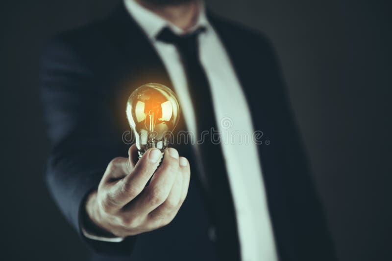 Man hand light bulb stock image. Image of business, computer - 192431645